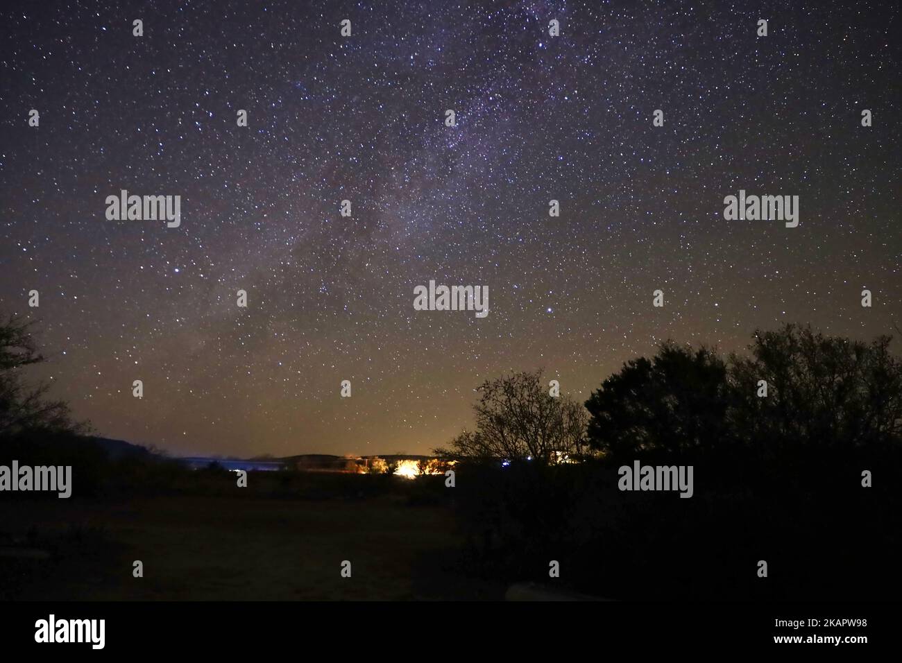 A starry night sky over the buildings Stock Photo - Alamy