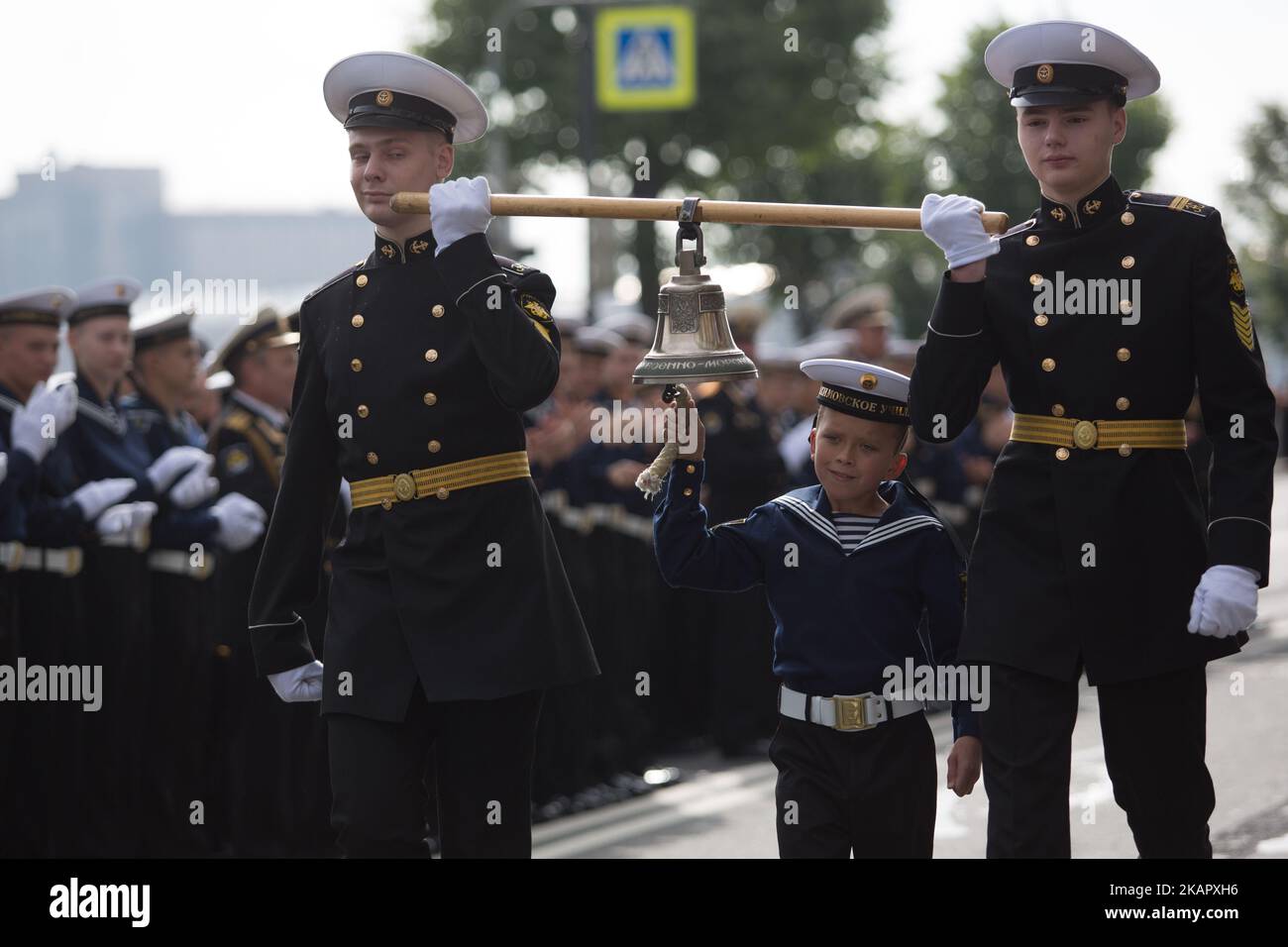 Nakhimov Naval School cadets march with a bell at a school line up ...