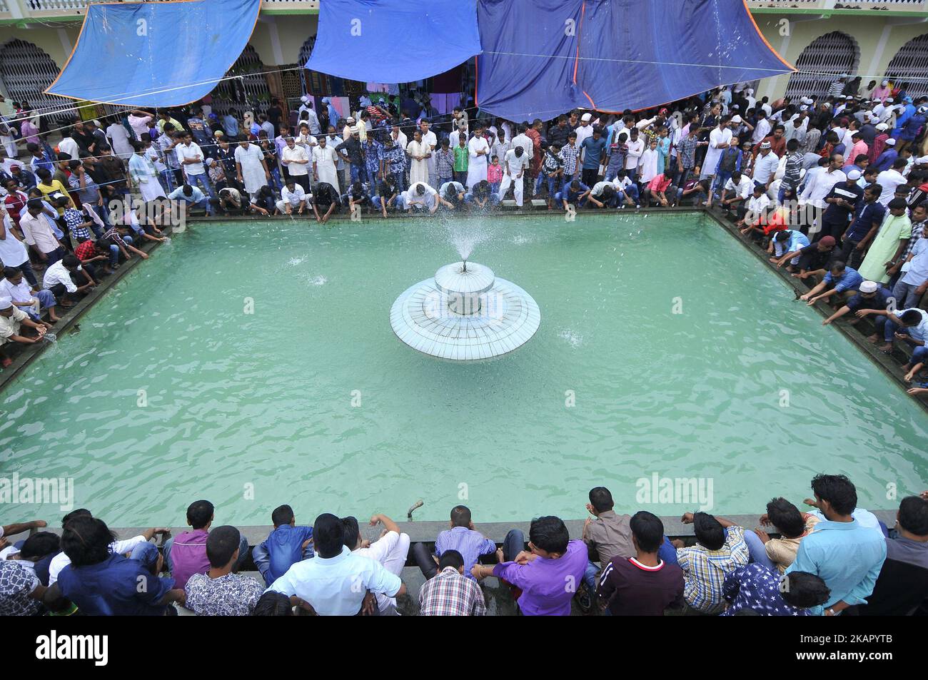 A Nepalese Muslim wash his hands, face and feet before praying during ...