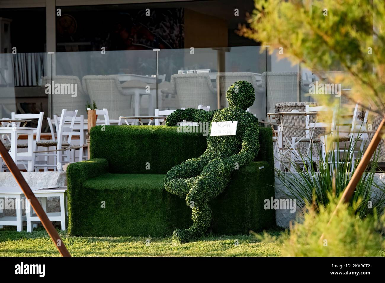 A beautiful green topiary figure in a park in Cyprus city at sunlight ...