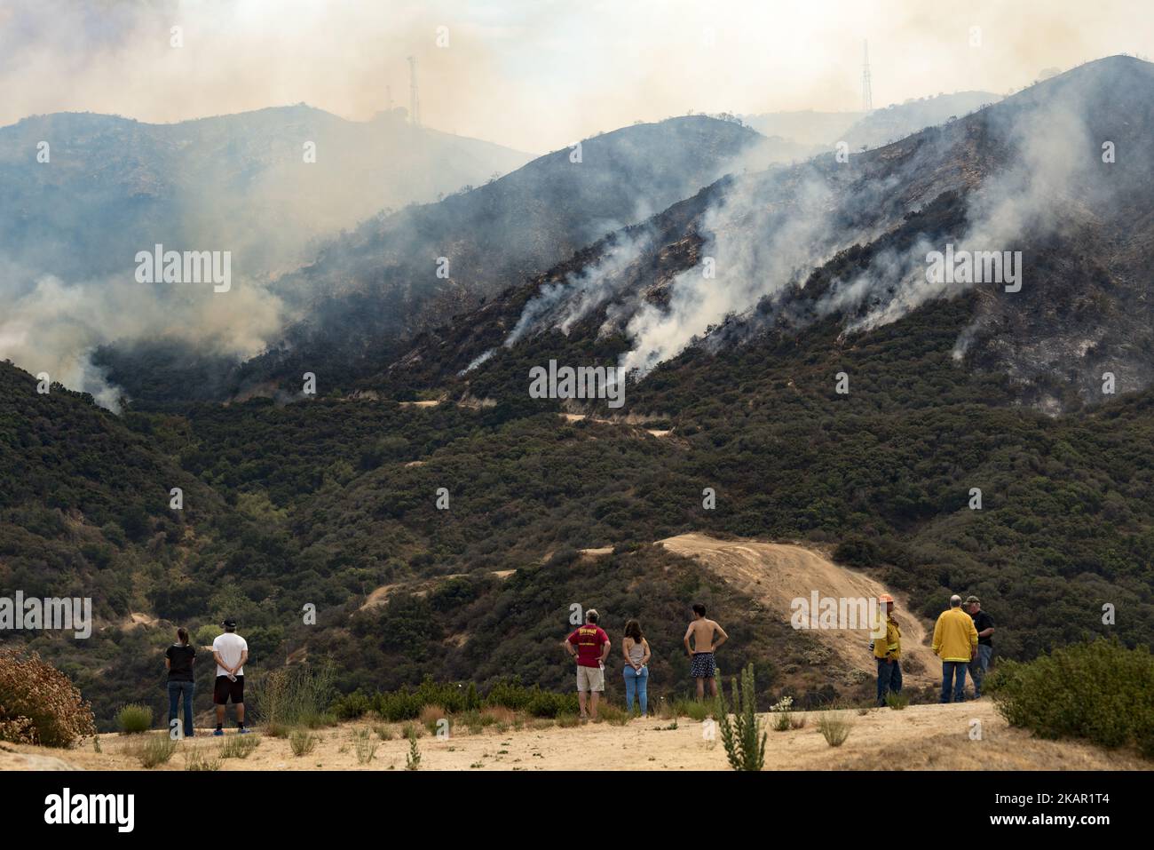 People watch the La Tuna Canyon fire in Los Angeles, California on ...