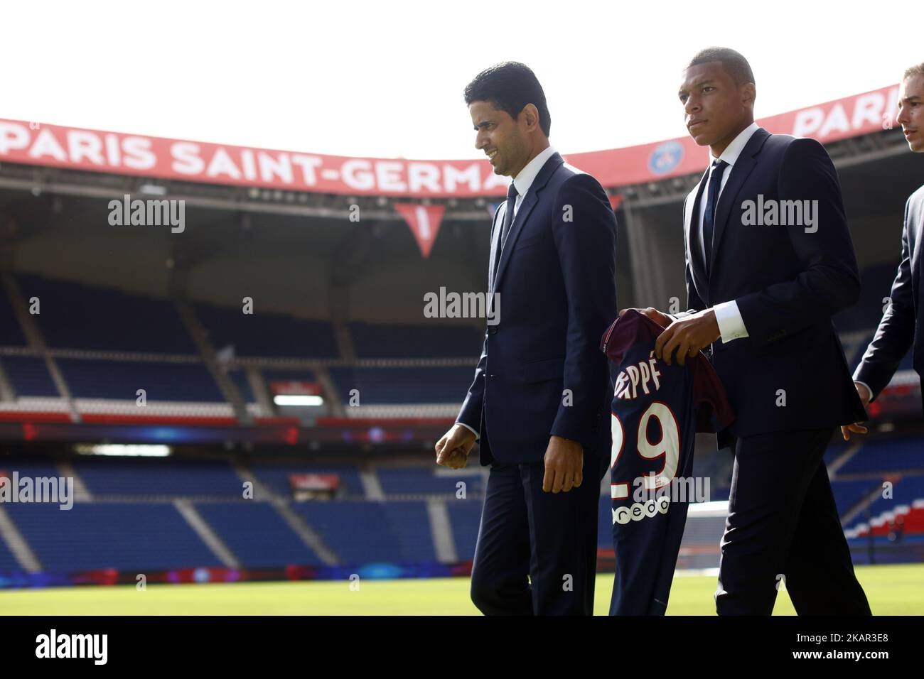 (L-R) Paris Saint-Germain President Nasser Al Khelaifi poses alongside new signing Kylian Mbappe ...