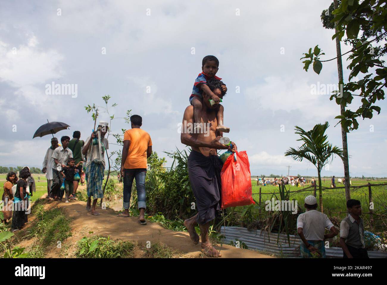 Man cradles child in hi-res stock photography and images - Alamy