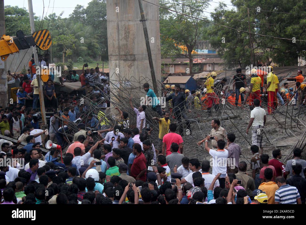 ODRF (Odisha Disaster Response Force) and fire fighters look near the ...