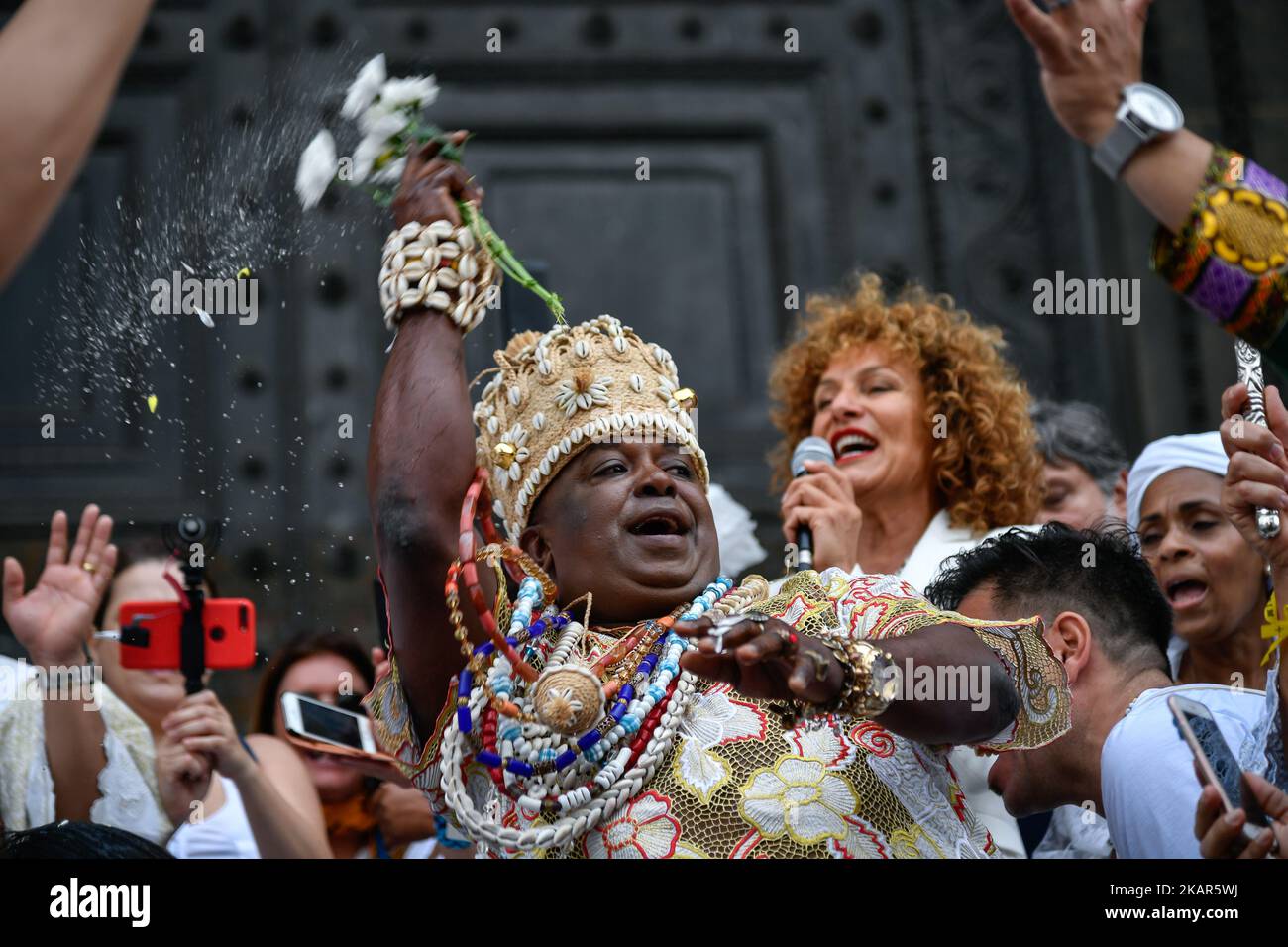 The Afro-Brazilian high Priest baptized people with flowers and holy ...