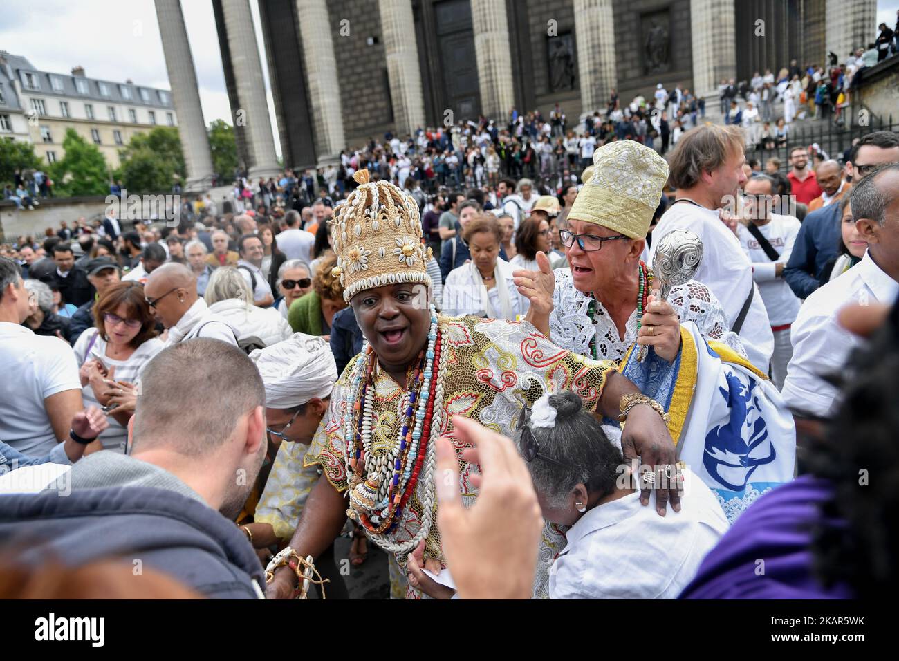 the Afro-Brazilian high Priest baptized people with flowers and holy ...