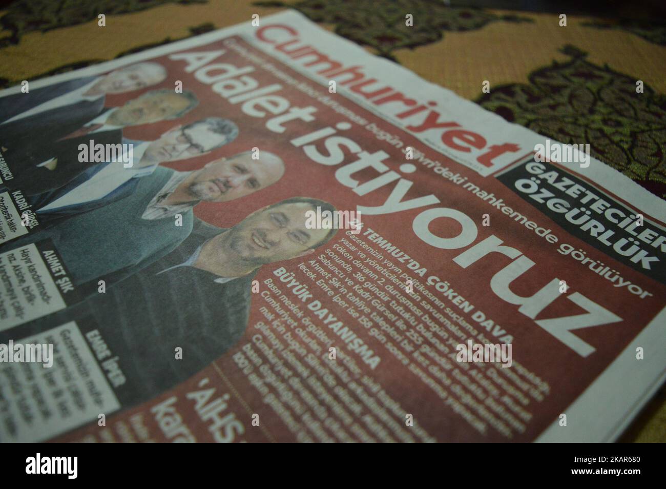 A copy of Turkey's opposition daily newspaper Cumhuriyet is displayed ...