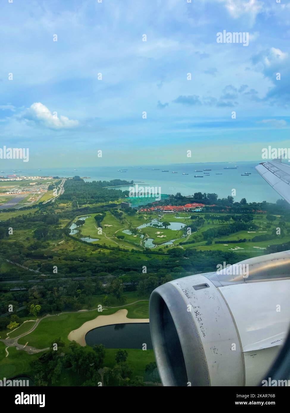 An ocean seen through an airplane window Stock Photo - Alamy