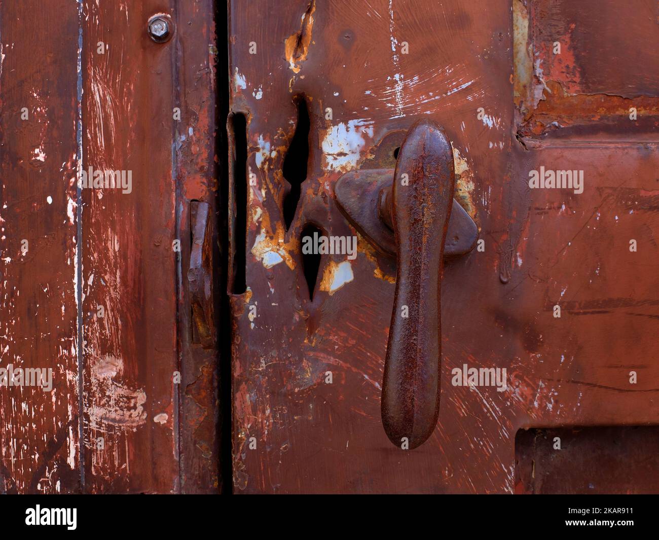 Rusty door handle and latch that is worn and broken Stock Photo - Alamy