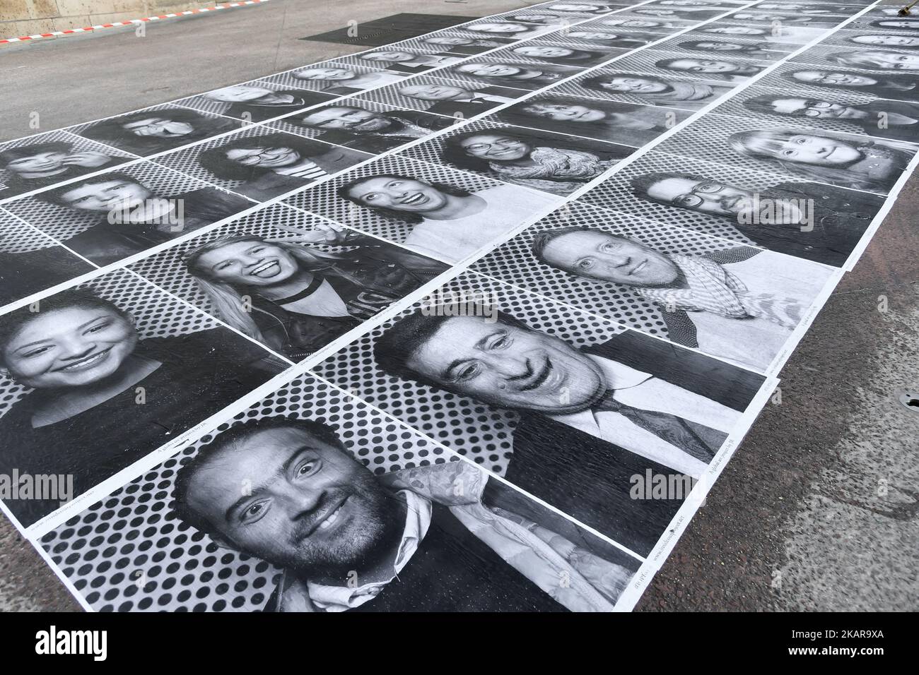 The street artist JR performing the Inside Out Project at the Mairie d ...
