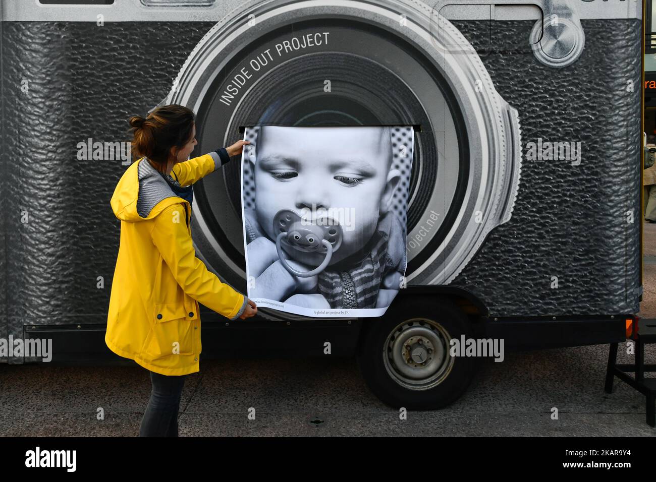 The street artist JR performing the Inside Out Project at the Mairie d ...