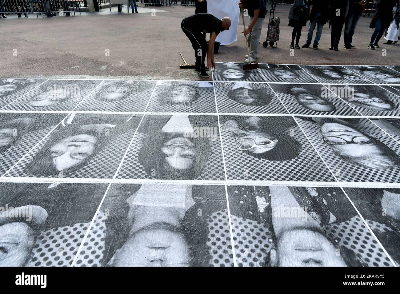 The street artist JR performing the Inside Out Project at the Mairie d ...