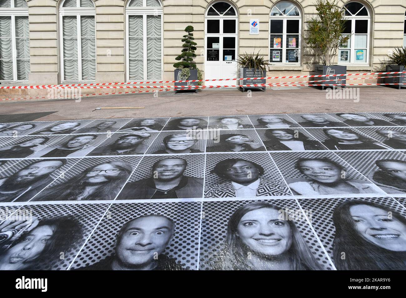 The street artist JR performing the Inside Out Project at the Mairie d ...