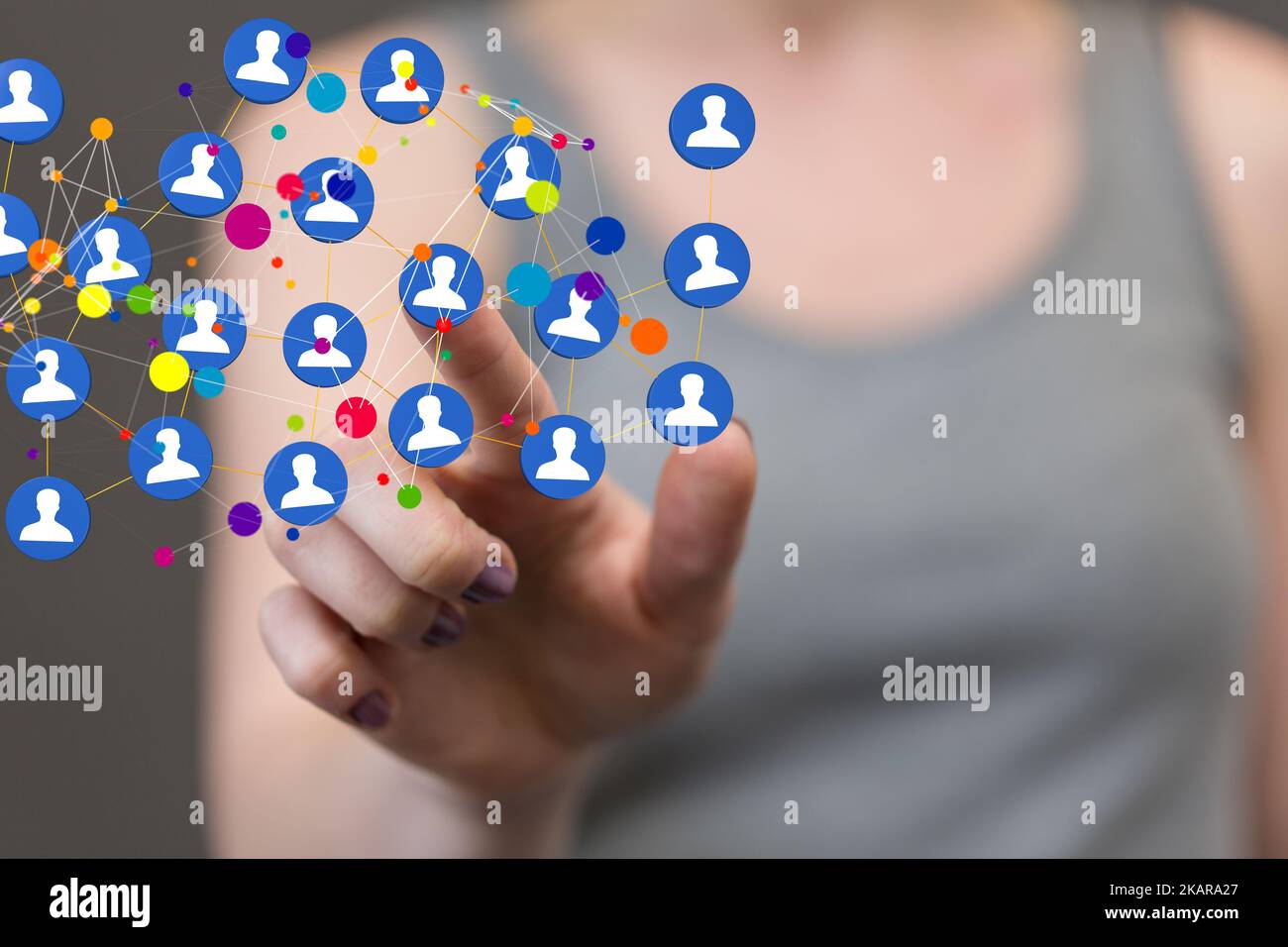 The woman's hand pointing at the hovering 3d profile icons Stock Photo ...