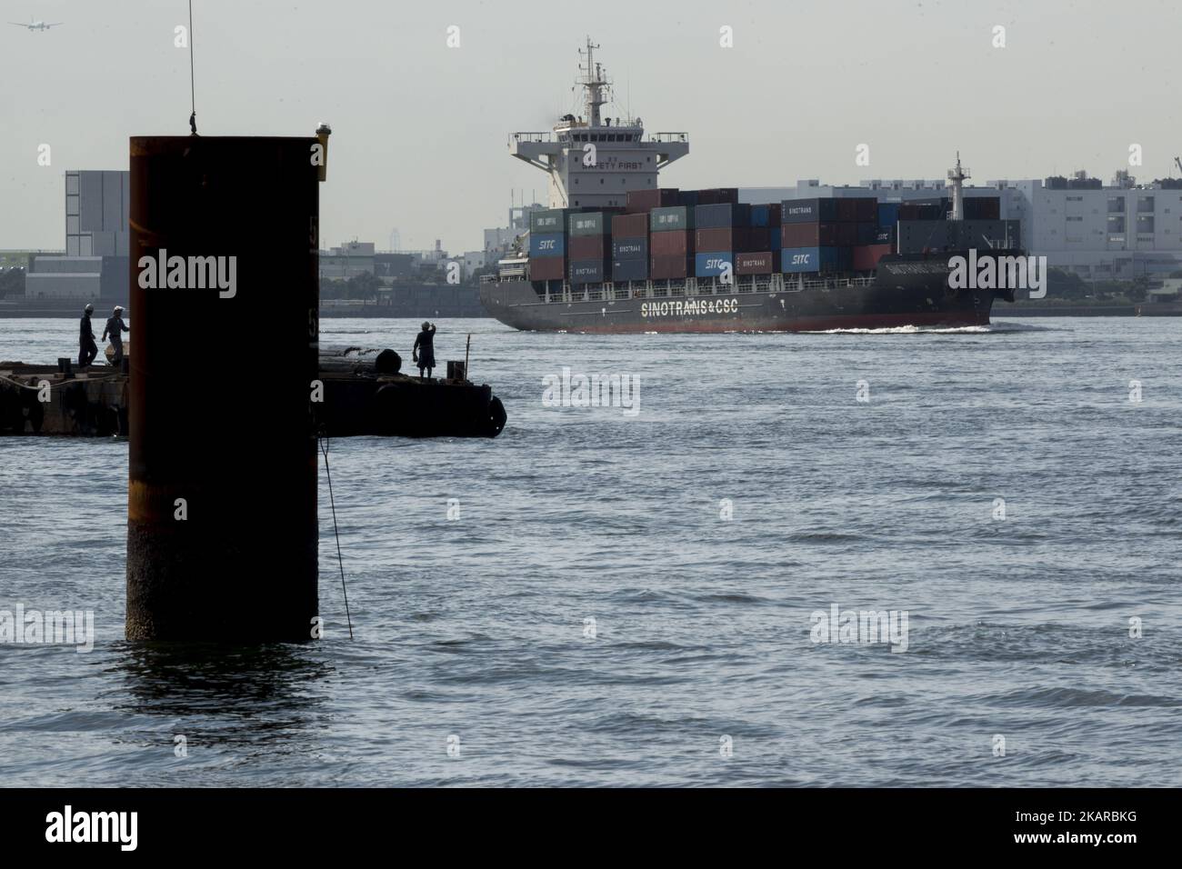 A container ship arrives at a port in Tokyo, September 19, 2017. The ...