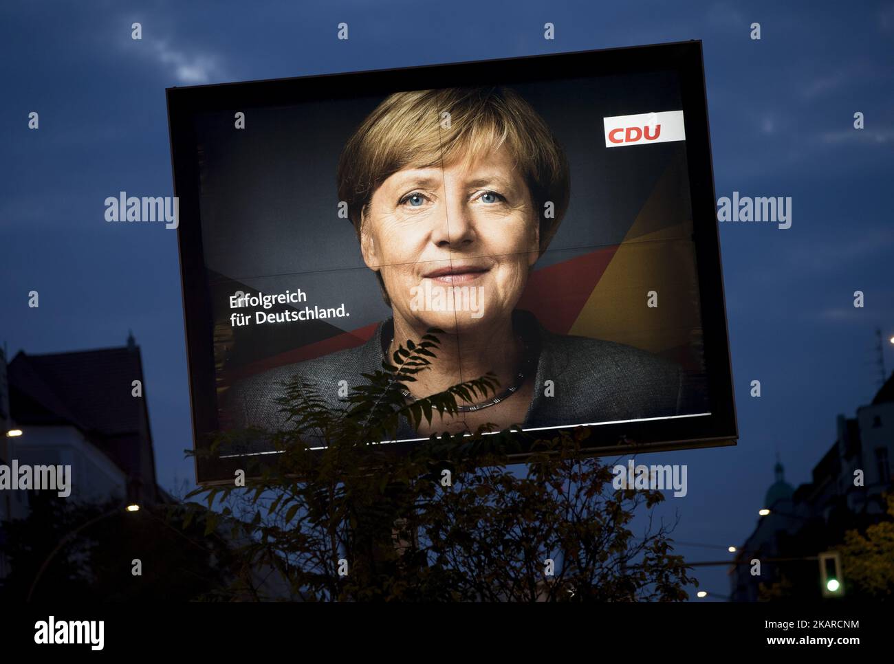 An election poster of German Chancellor Angela Merkel (CDU) are ...