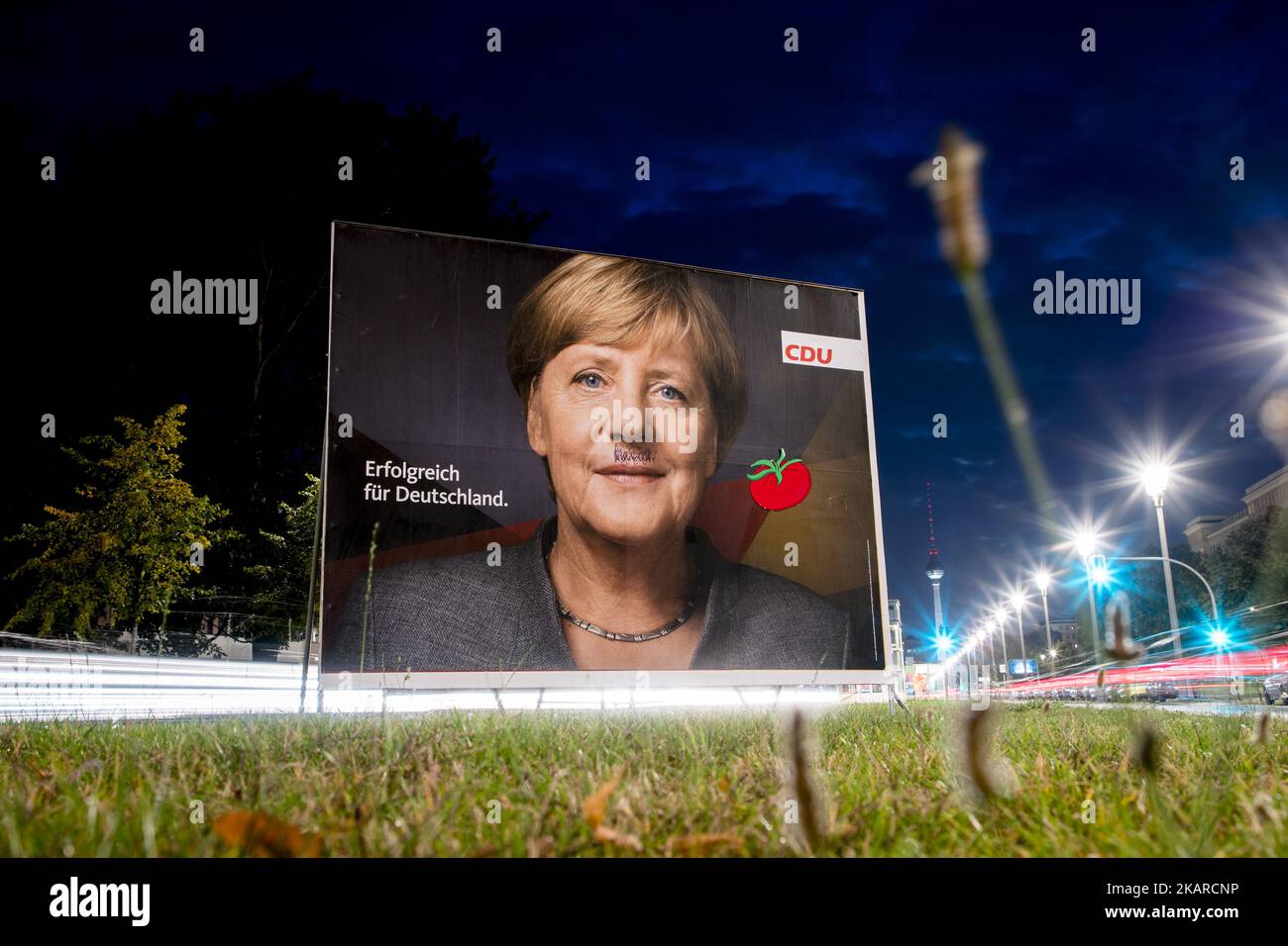 A vandalized election poster of German Chancellor Angela Merkel (CDU ...