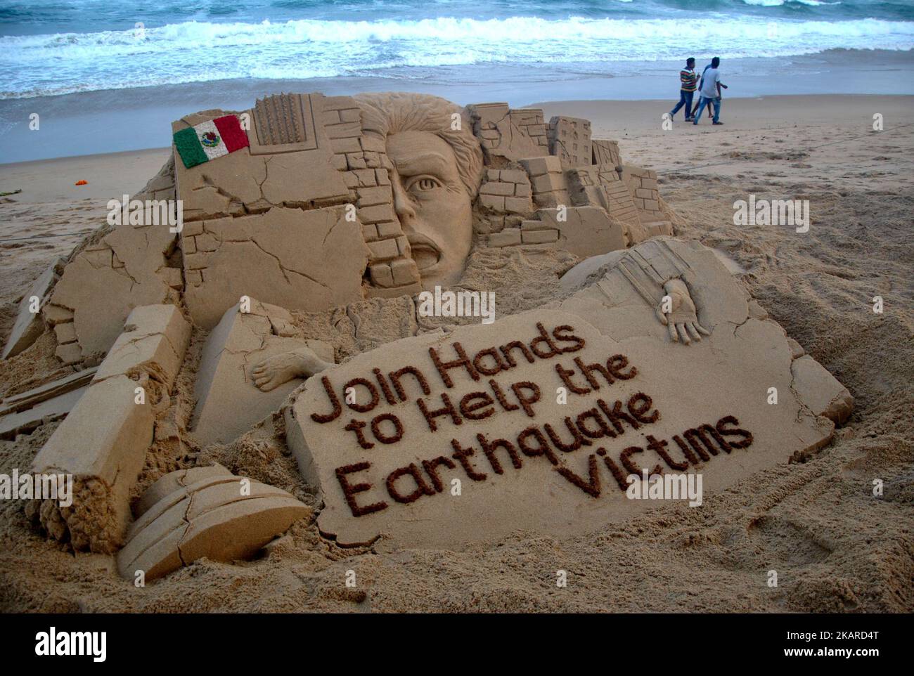 A sand art is seen on the Bay of Bengal Sea's eastern coast at Puri ...