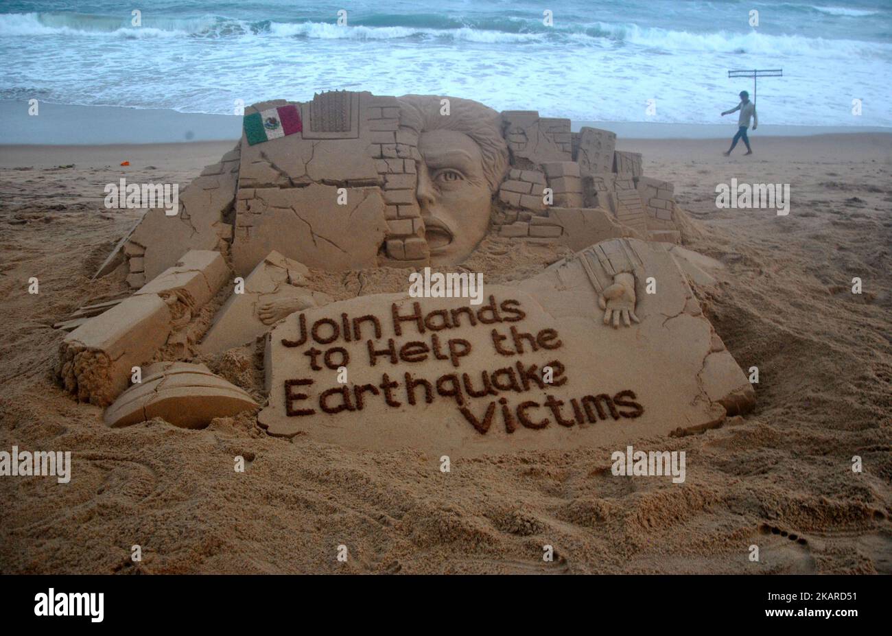 A sand art is seen on the Bay of Bengal Sea's eastern coast at Puri ...