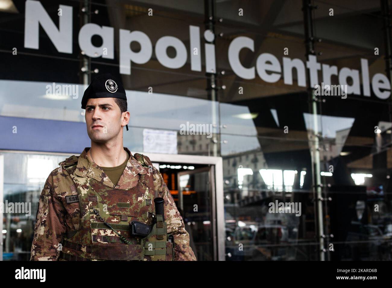Italian troops stand guard outside the Central Station by Naples ...