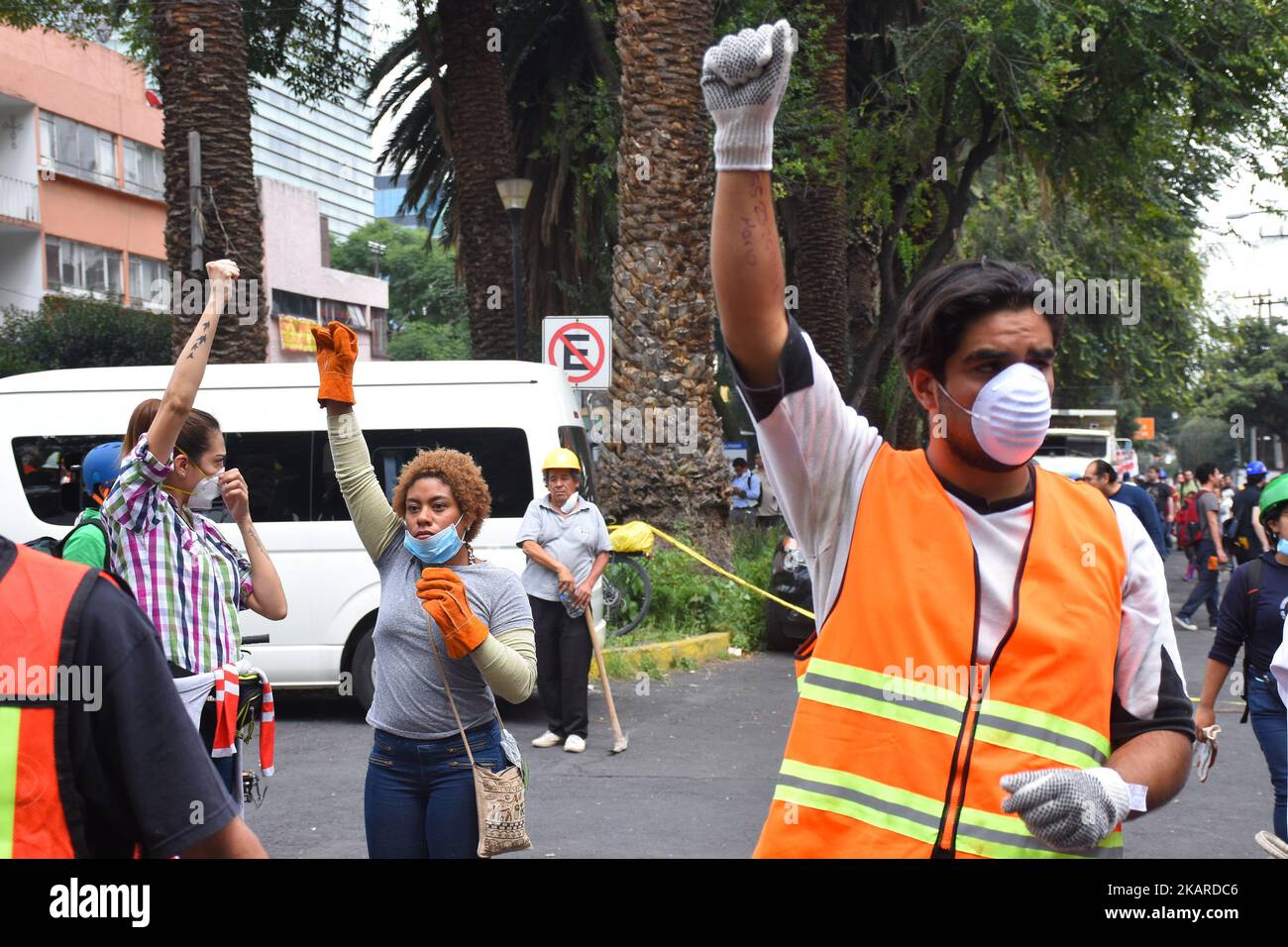 voluntaries are seen helping during the rescue of a person by the 7.1 ...