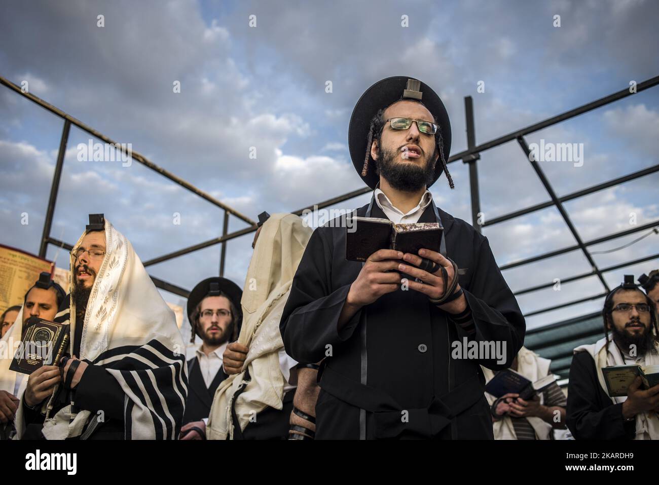 Orthodox Jewish pilgrims pray near the tomb of Rabbi Nachman while ...