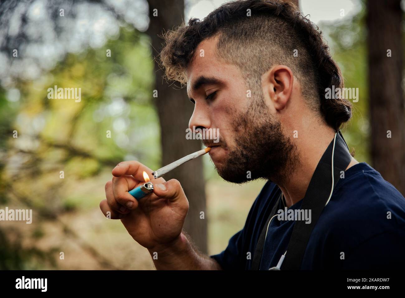Man smoking joint drinking hi-res stock photography and images - Alamy