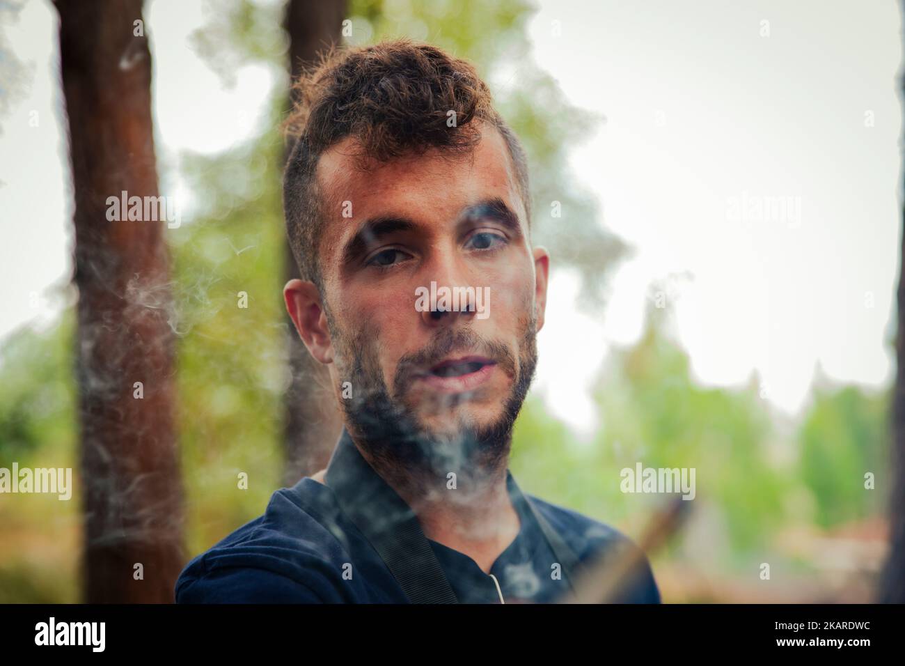 Close up young man smoking marijuana joint cigarette smoke hi-res stock ...