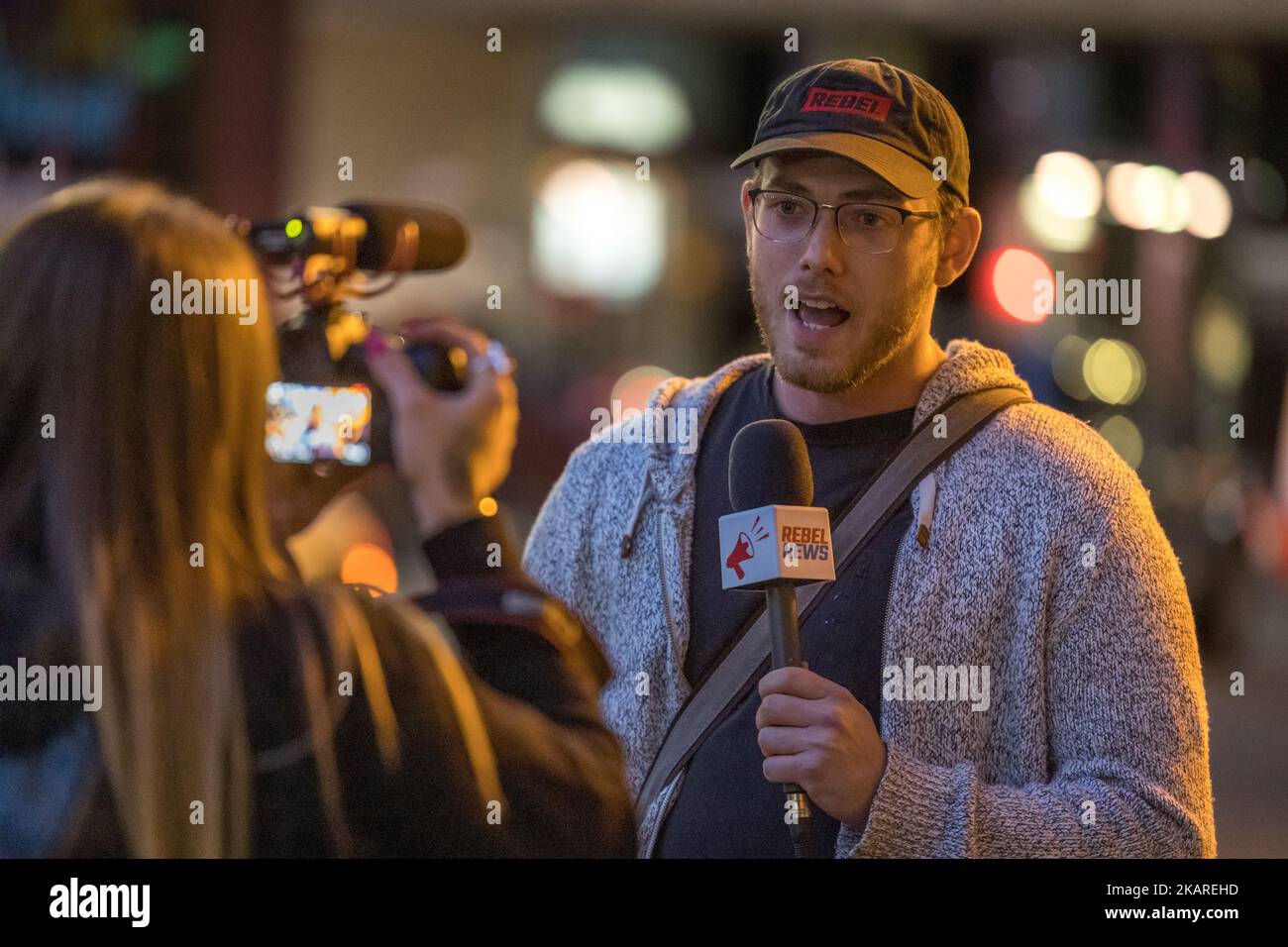 A Rebel News reporter on the scene of a protest Stock Photo - Alamy