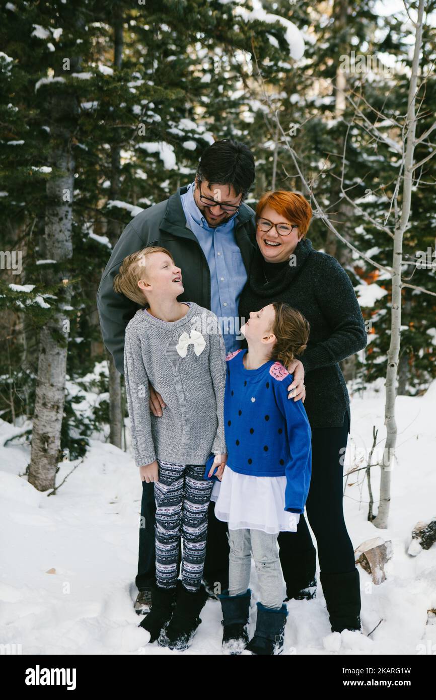 Family laughs hugs in hi-res stock photography and images - Alamy