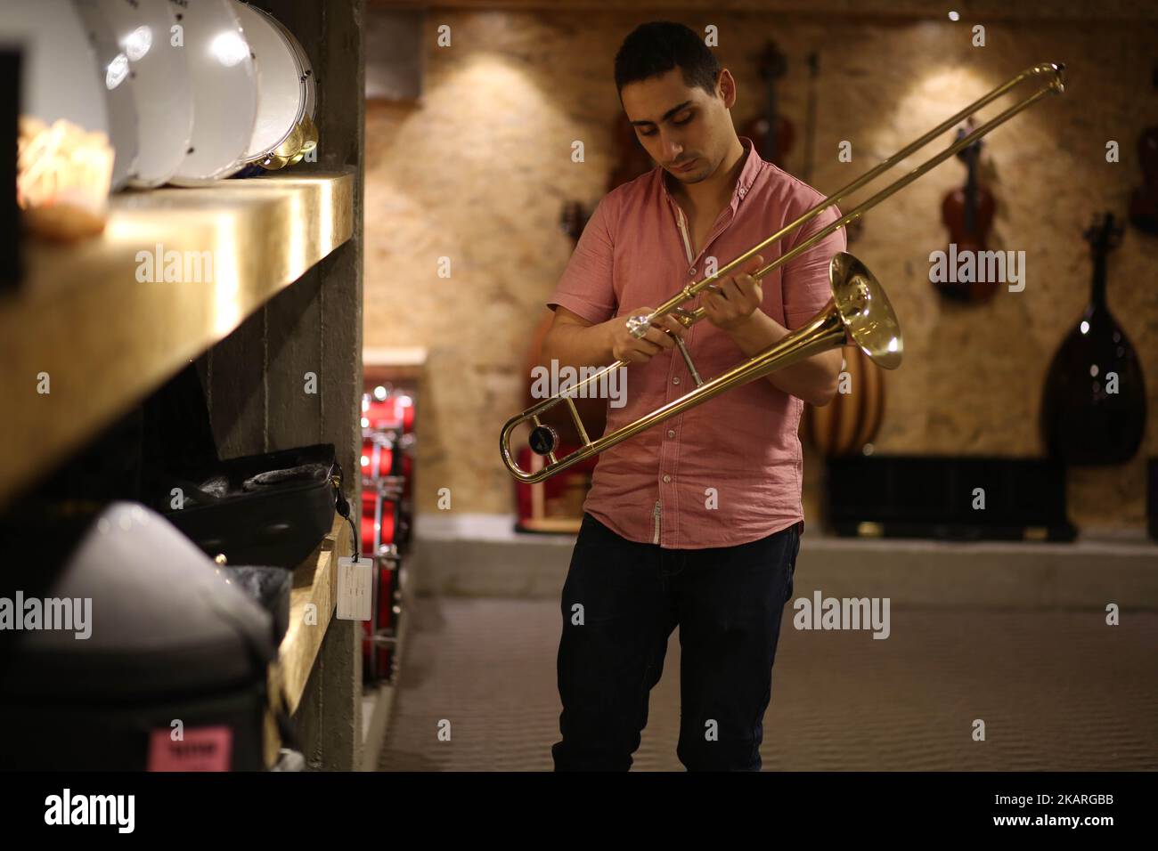 A Palestinian who works in the JARU Electronics Shop selling musical ...
