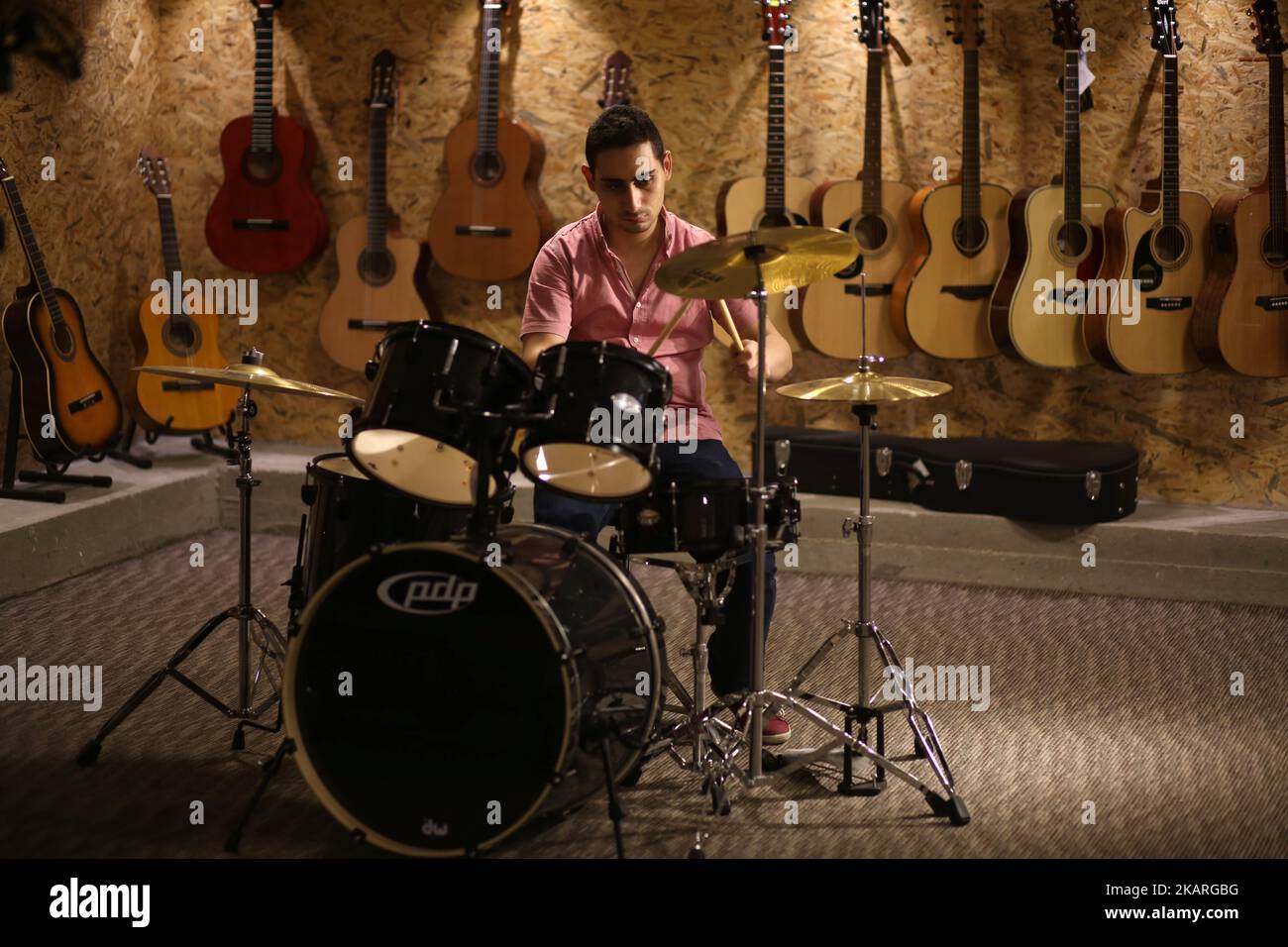 A Palestinian who works in the JARU Electronics Shop selling musical ...