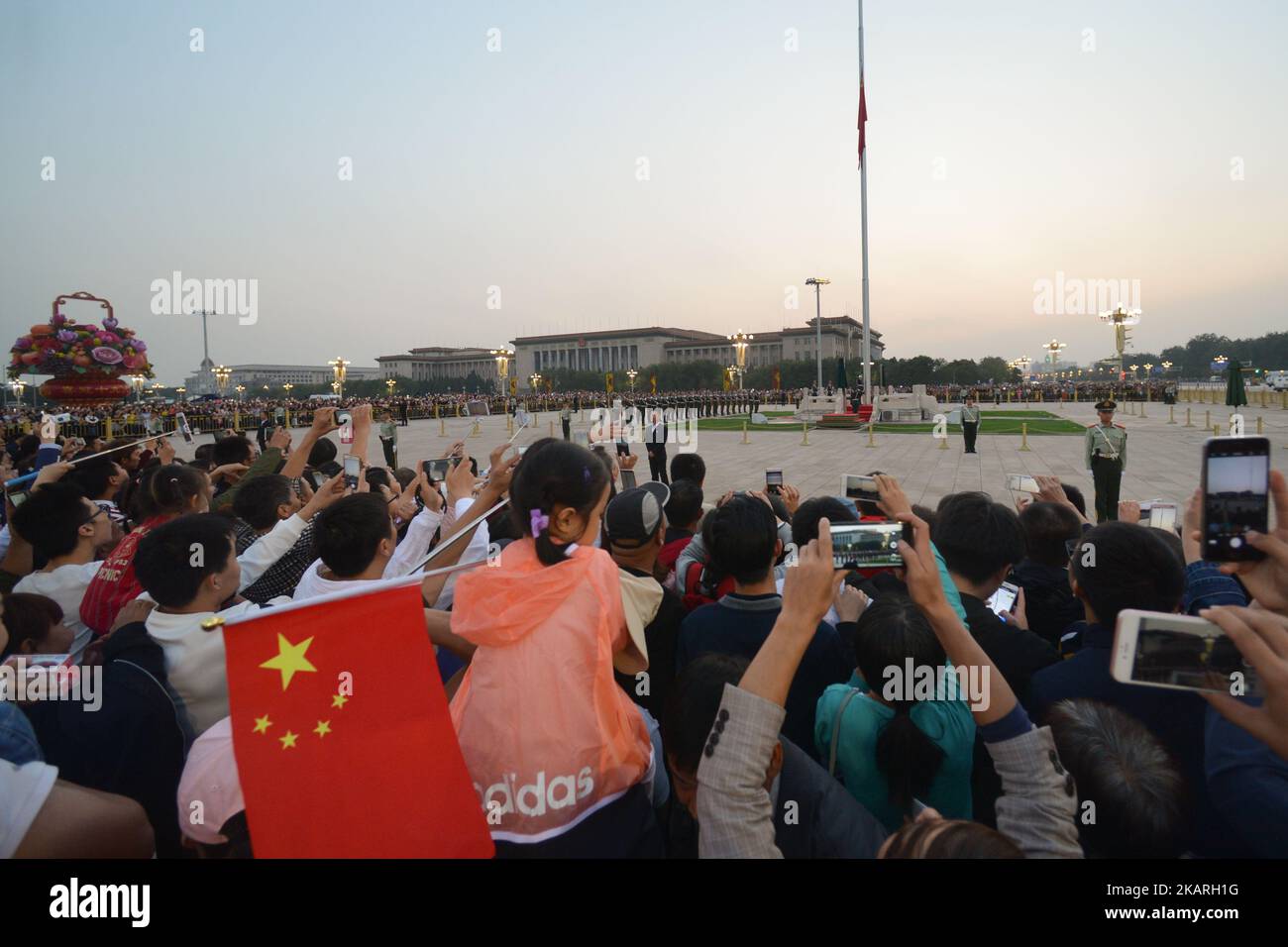 A view of the crowd watching the lowering of the National Flag Ceremony ...