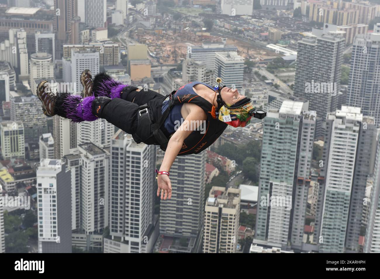 Base jumpers leaps from the 300 meter high open deck at Kuala Lumpur ...