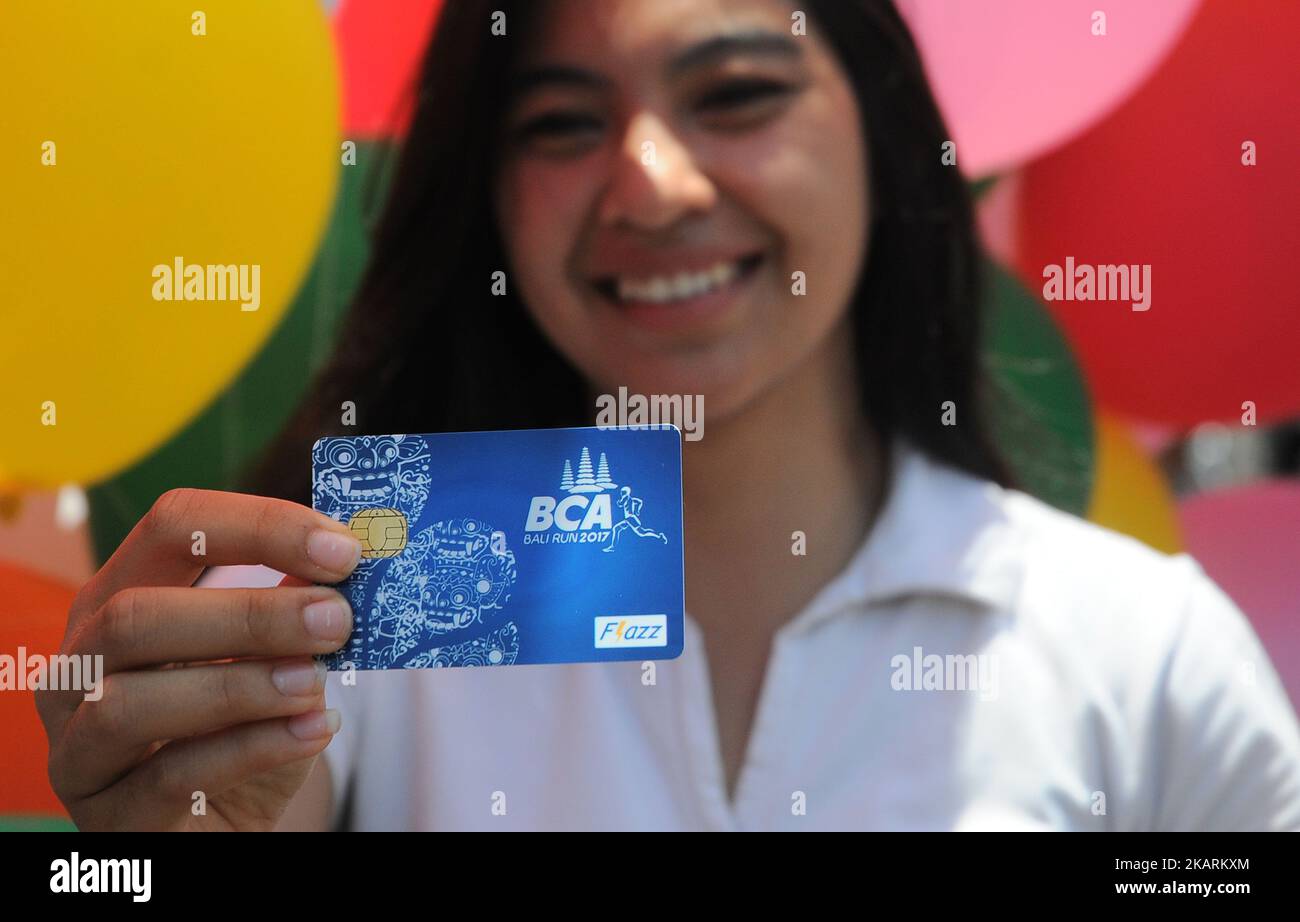 Model shows the electronic cards by banks in Indonesia during the ...