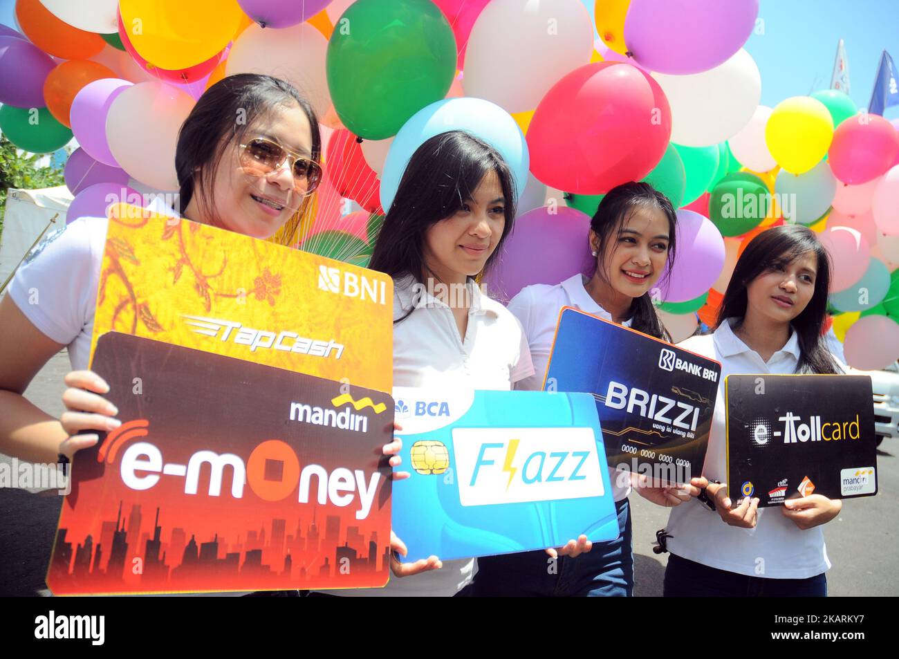 Model shows the electronic cards by banks in Indonesia during the ...