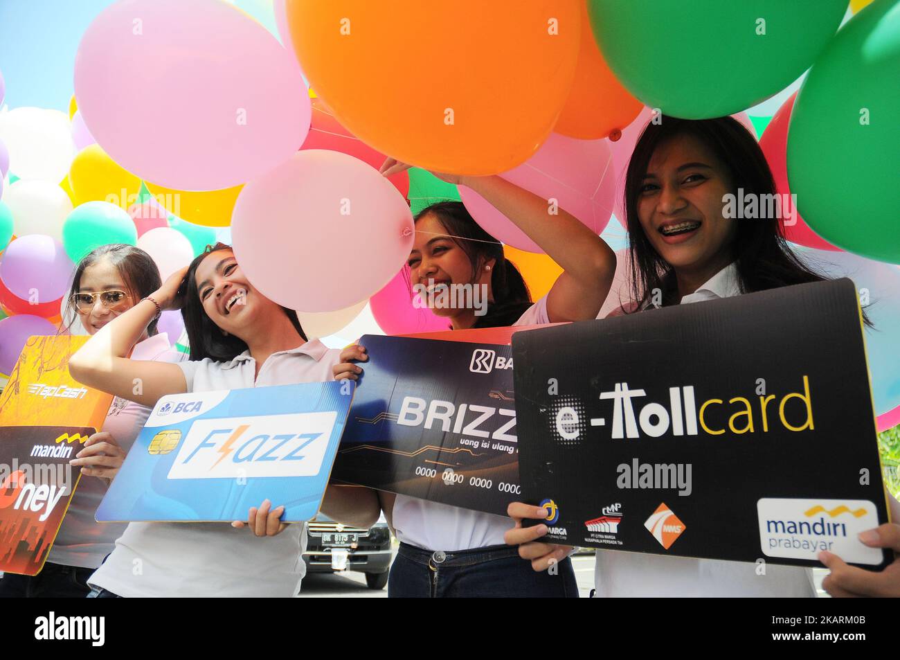 Model shows the electronic cards by banks in Indonesia during the ...