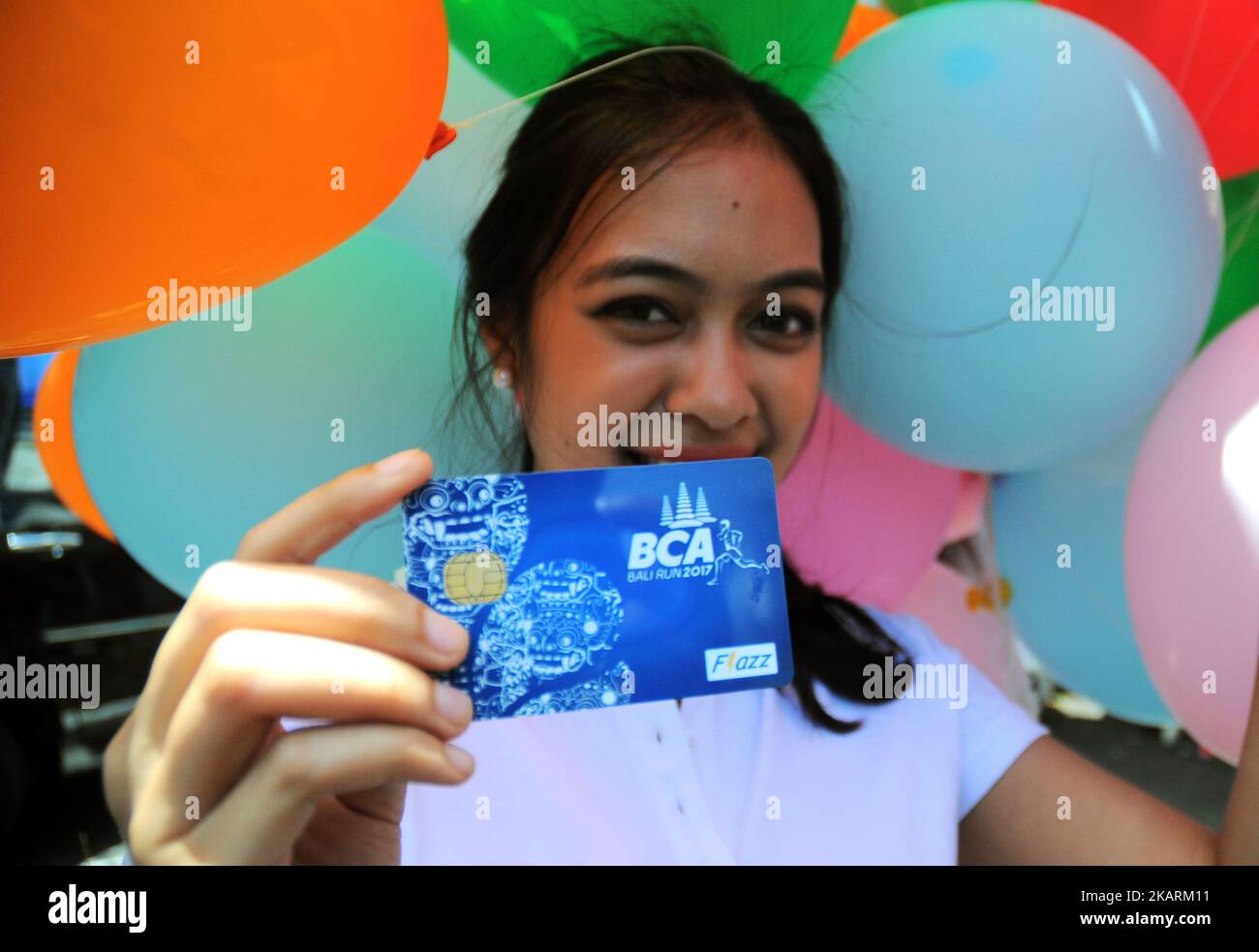 Model shows the electronic cards by banks in Indonesia during the ...