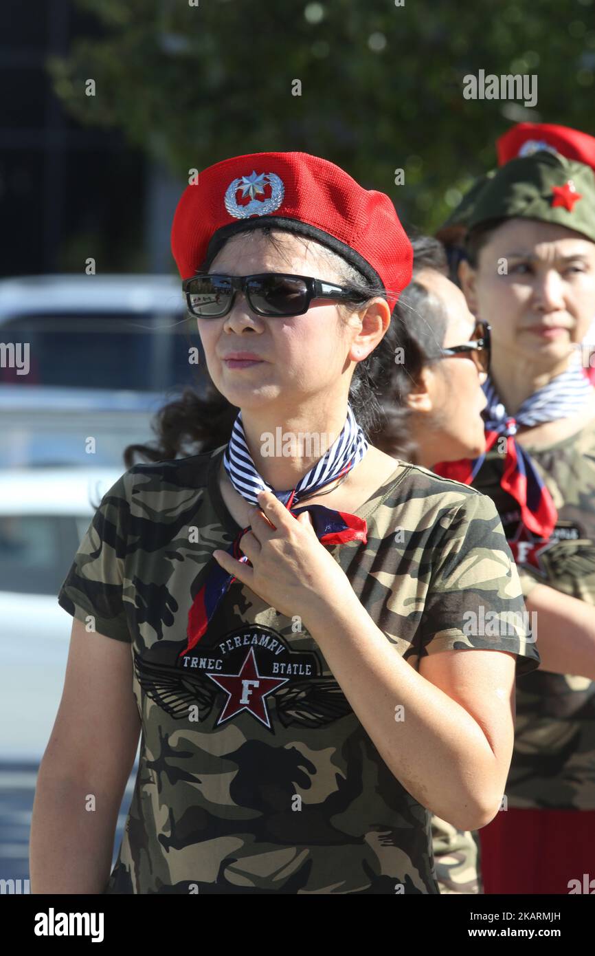 Chinese dancers dressed in military fatigues practice before a ...