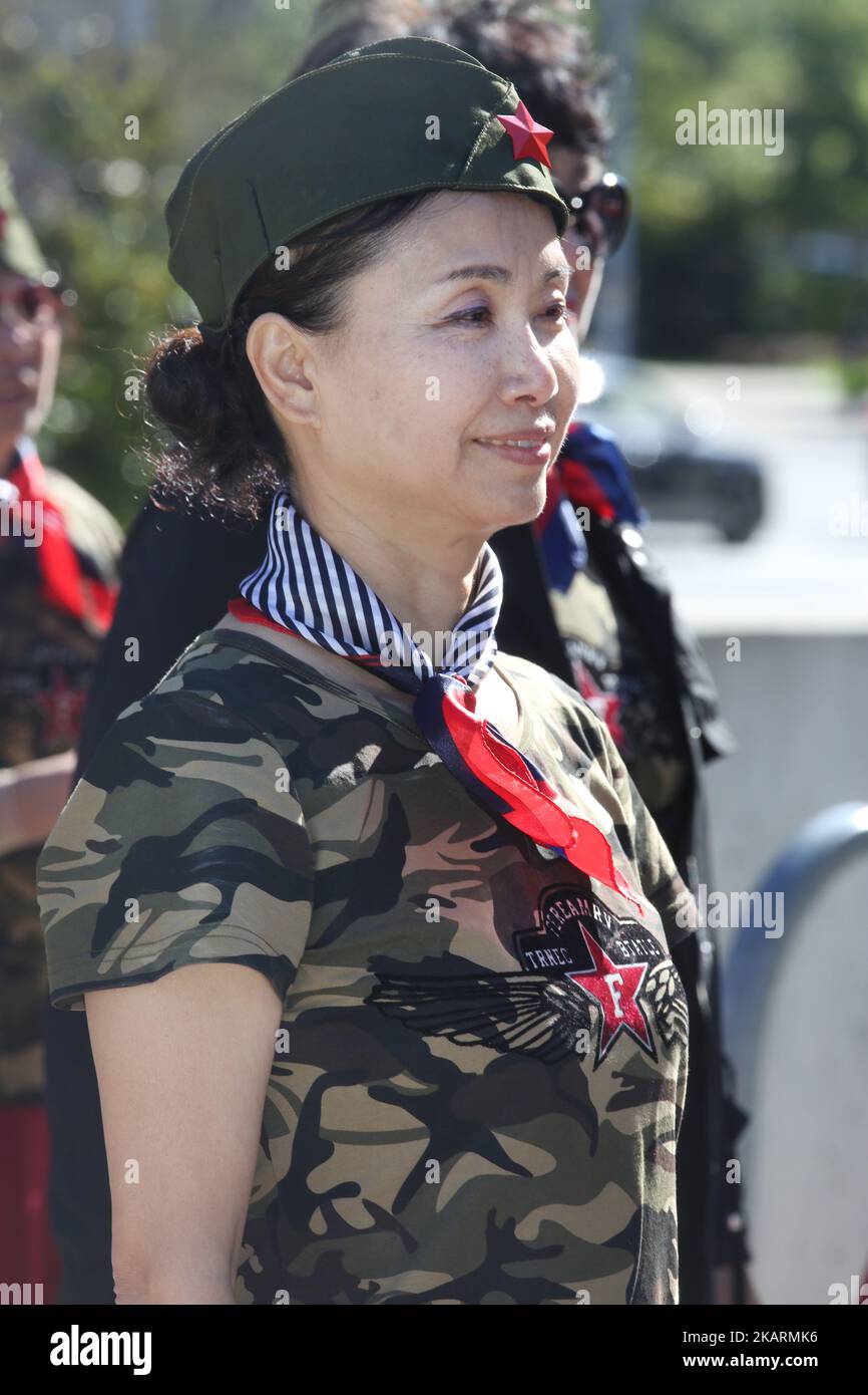 Chinese dancers dressed in military fatigues practice before a ...