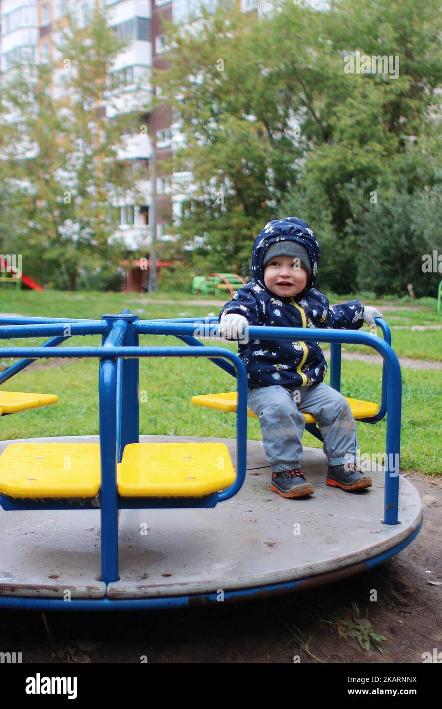 Little children carousel hi-res stock photography and images - Alamy