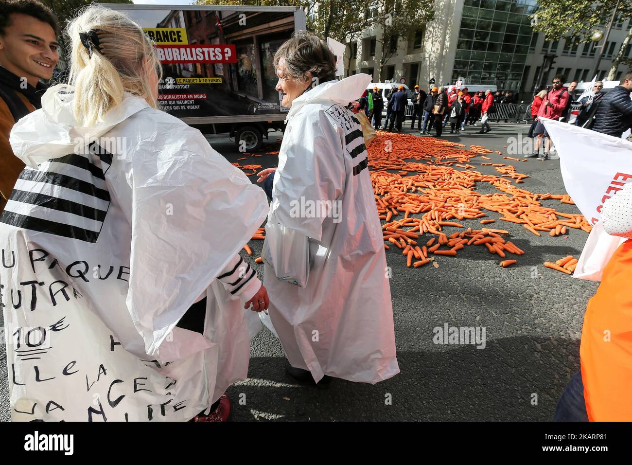 Tobacconists throw carrots on the street as they demonstrate against ...