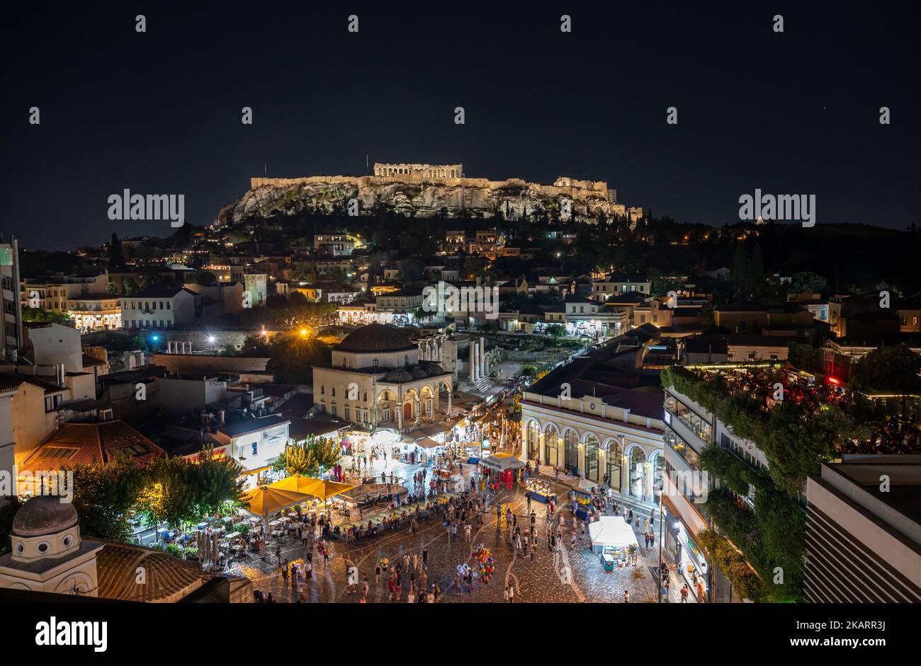 An aerial view of the colorful crowded Parthenon in Athens at night ...