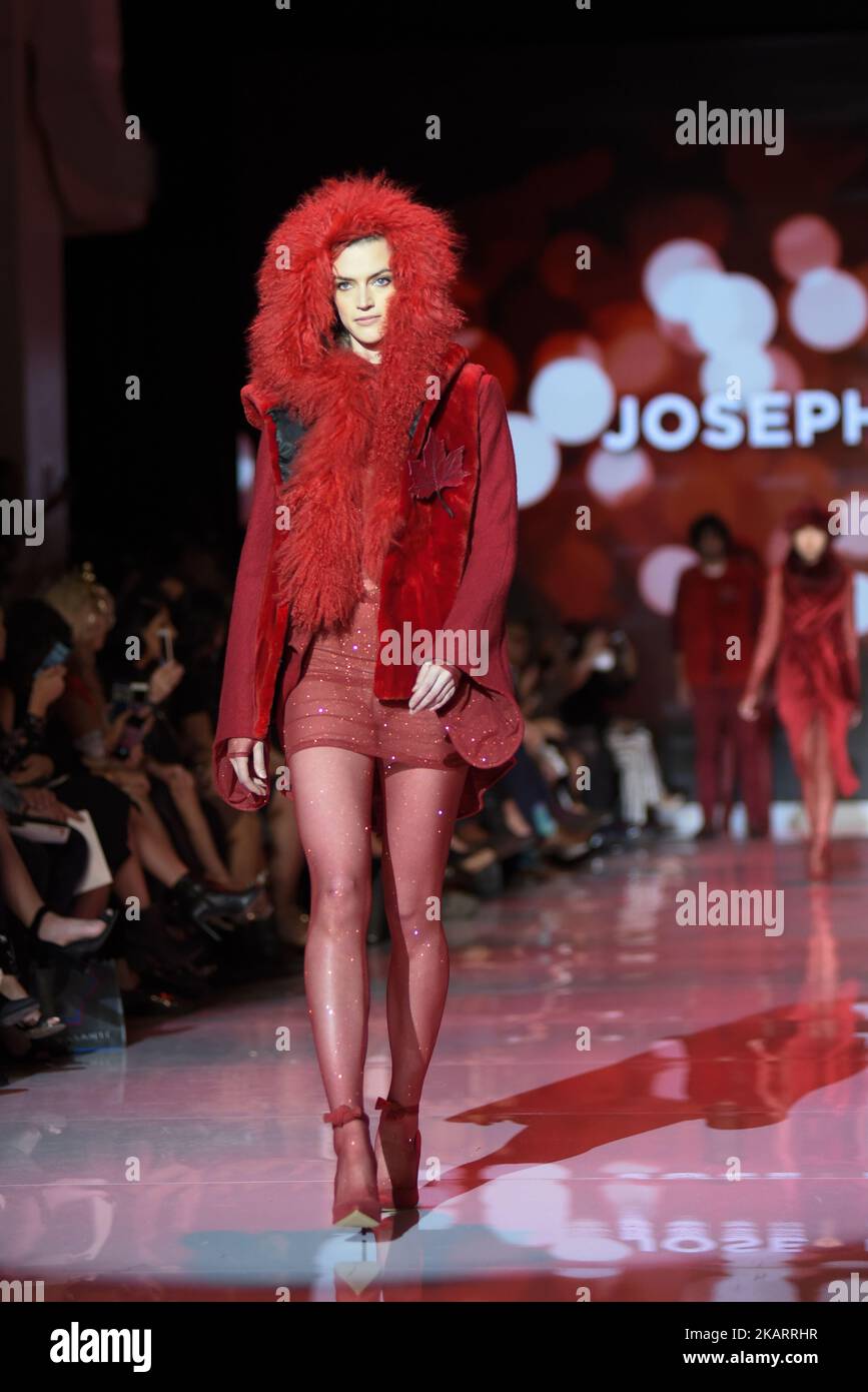 A model walking the runway during CANADA 150 Fashion show on day three ...