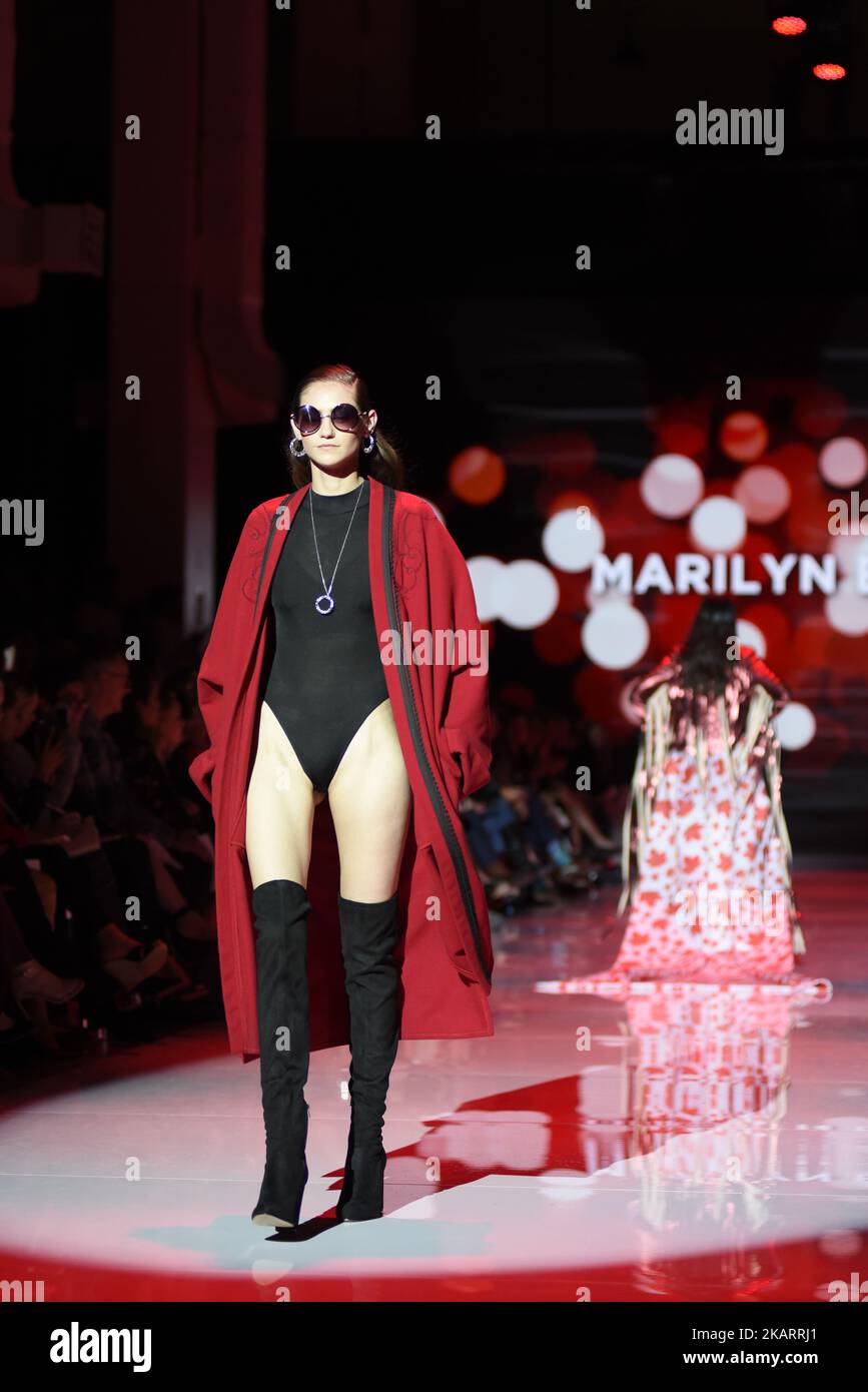 A model walking the runway during CANADA 150 Fashion show on day three ...