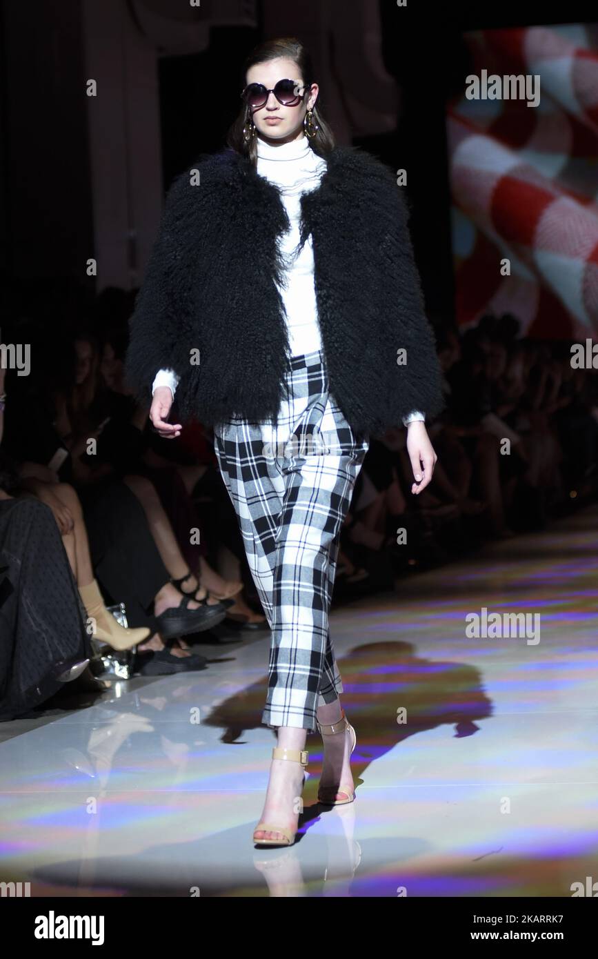 A model walking the runway during CANADA 150 Fashion show on day three ...