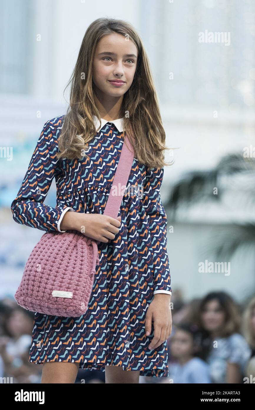 Model walks the runway during 'The Petite Fashion Week' at the Cibeles ...
