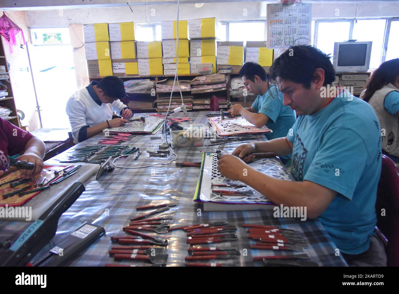 Workers are seen during the Manufactured of the traditional perforated ...