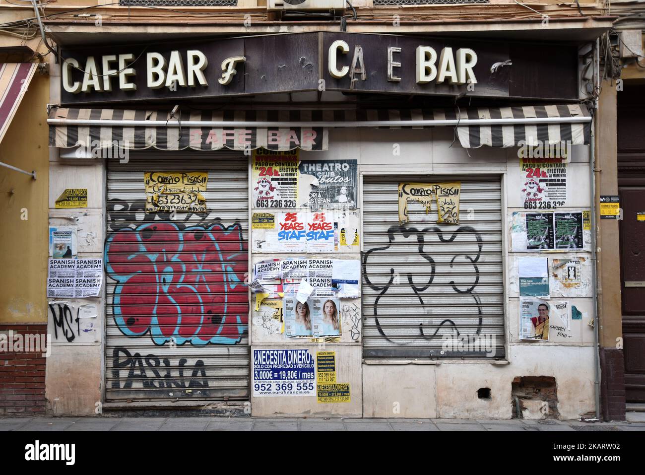 Graffiti on the shutters of a closed bar in Malaga, Spain Stock Photo ...
