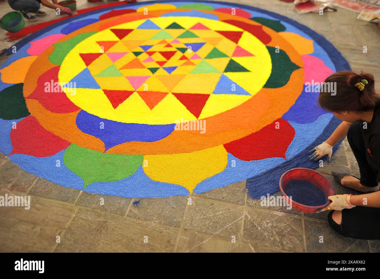 Nepalese artists from Kumari Art Gallery making a Mandala during the ...